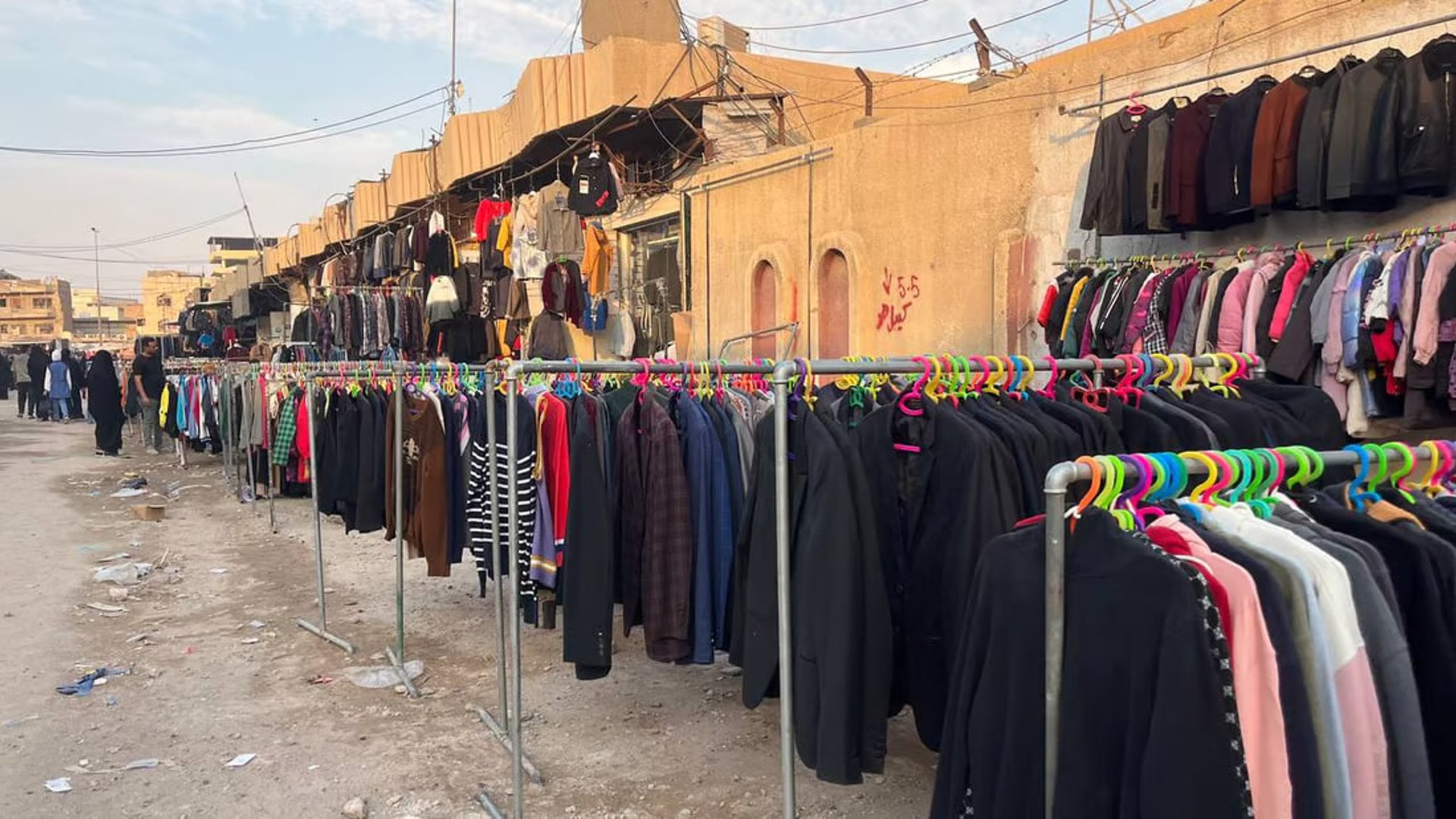 Second-hand winter clothes market in Basra offers global brands at ...