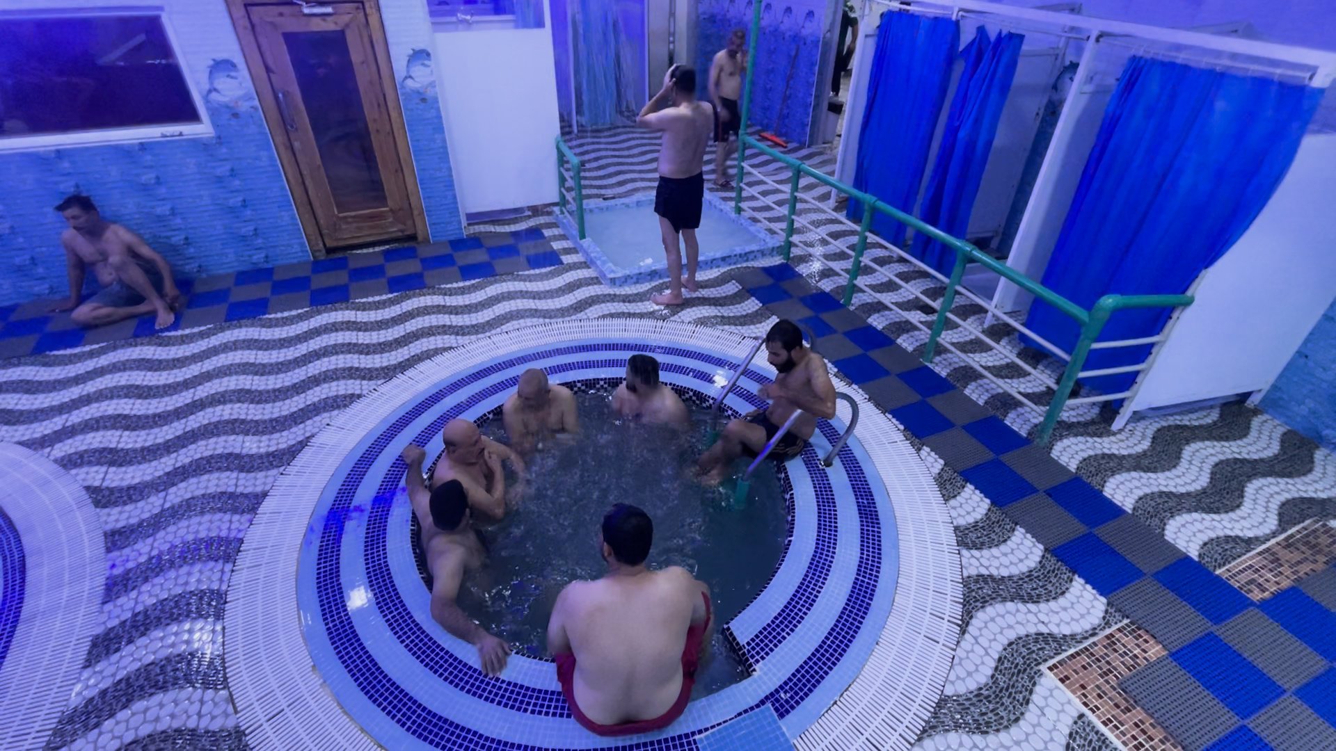 Iraqis flock to indoor pools in Najaf amid severe power outages and ...