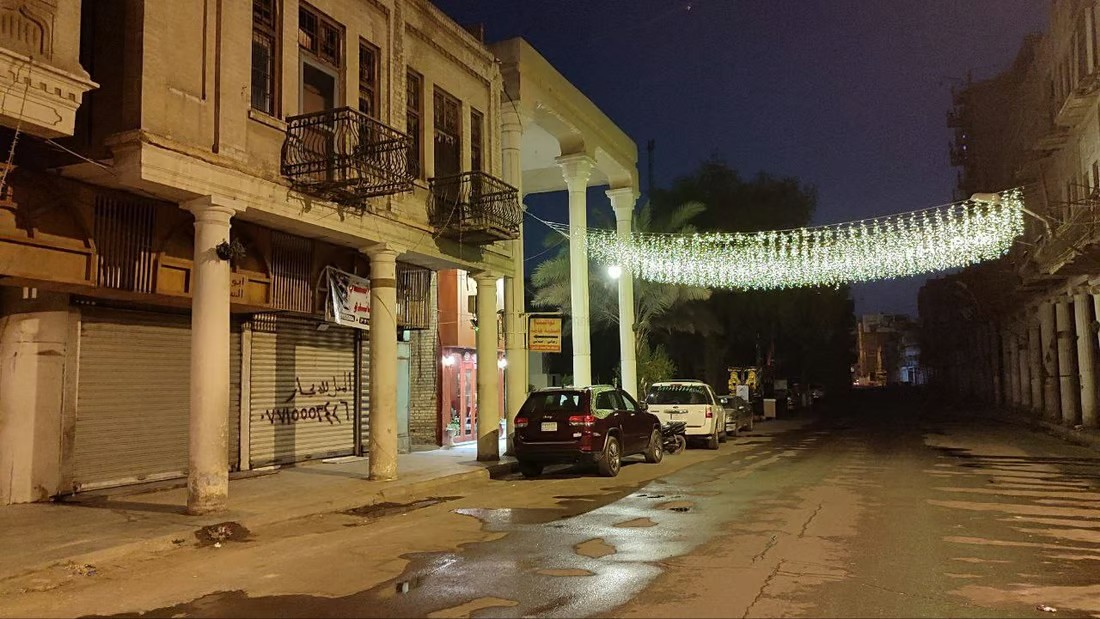 Al-Rashid Street: once a bustling hub, now dark and deserted. » 964media