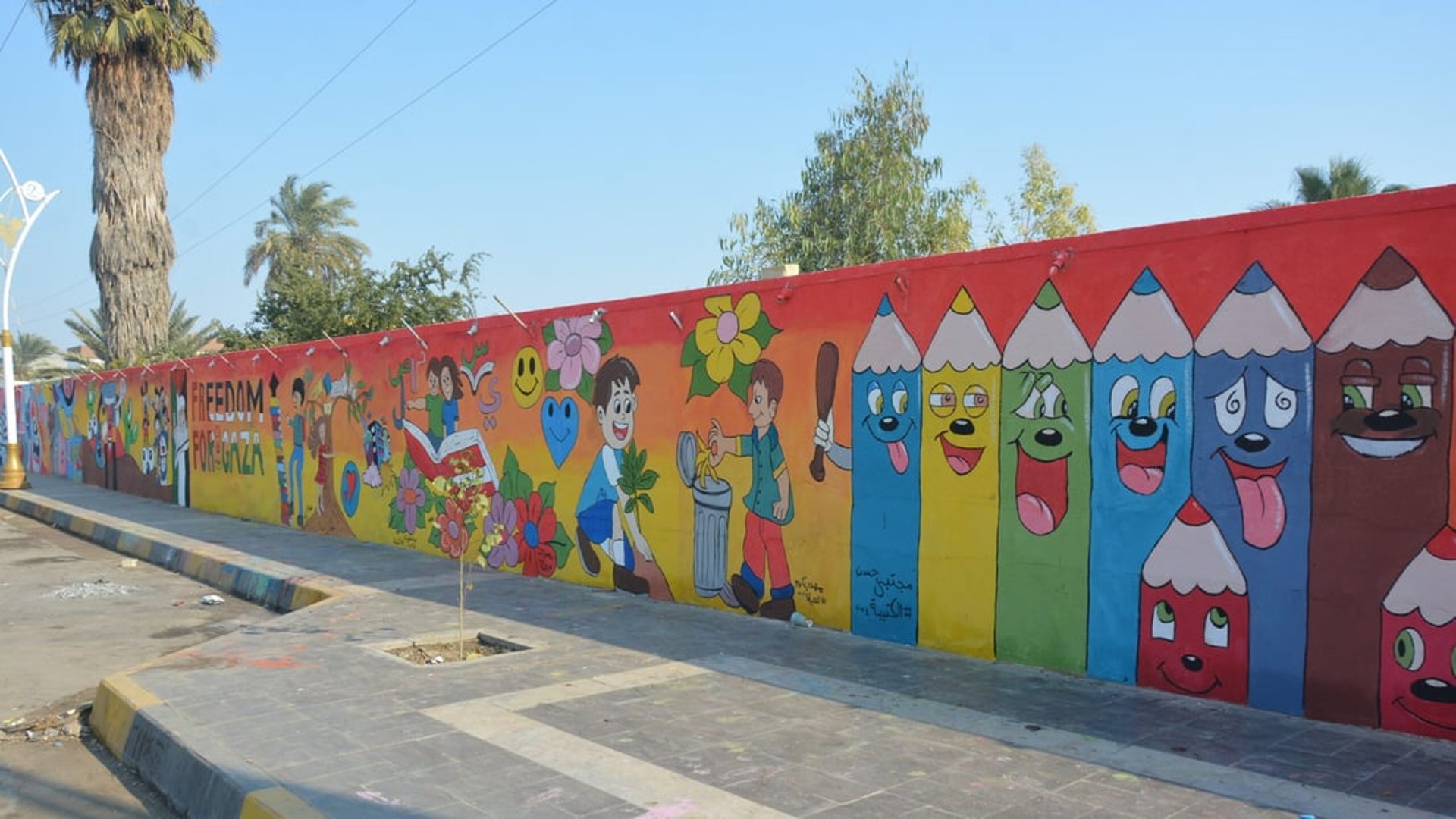 Students and artists breathe new life into Balad’s walls with colorful ...